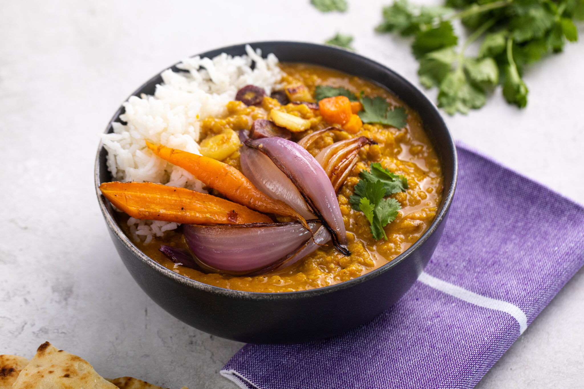 Lentil Dal topped with Roasted Vegetables - Lakewinds Food Co-op